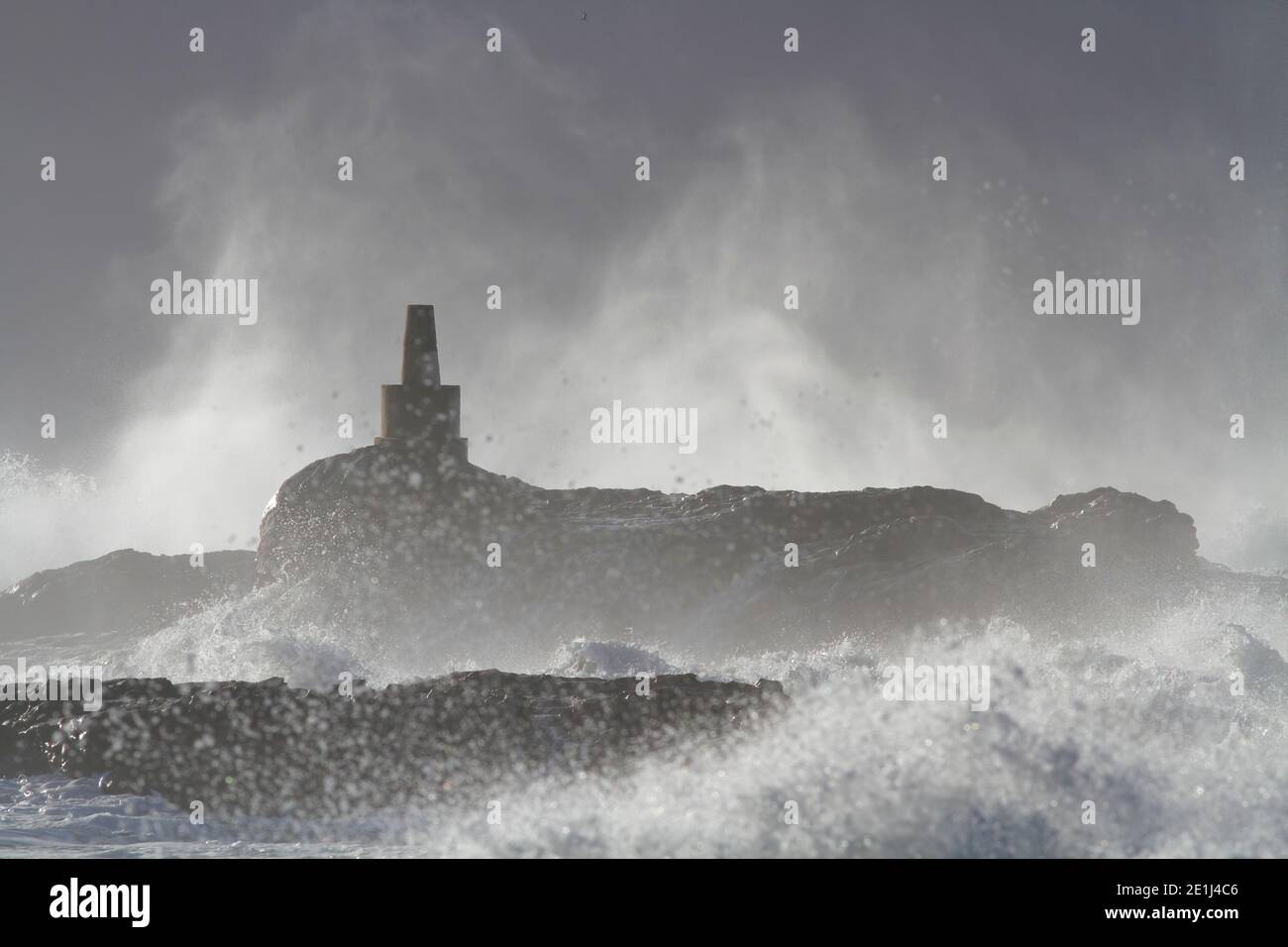 Storm on the coast seeig big wave breaking over rocks and cliffs seeing ...