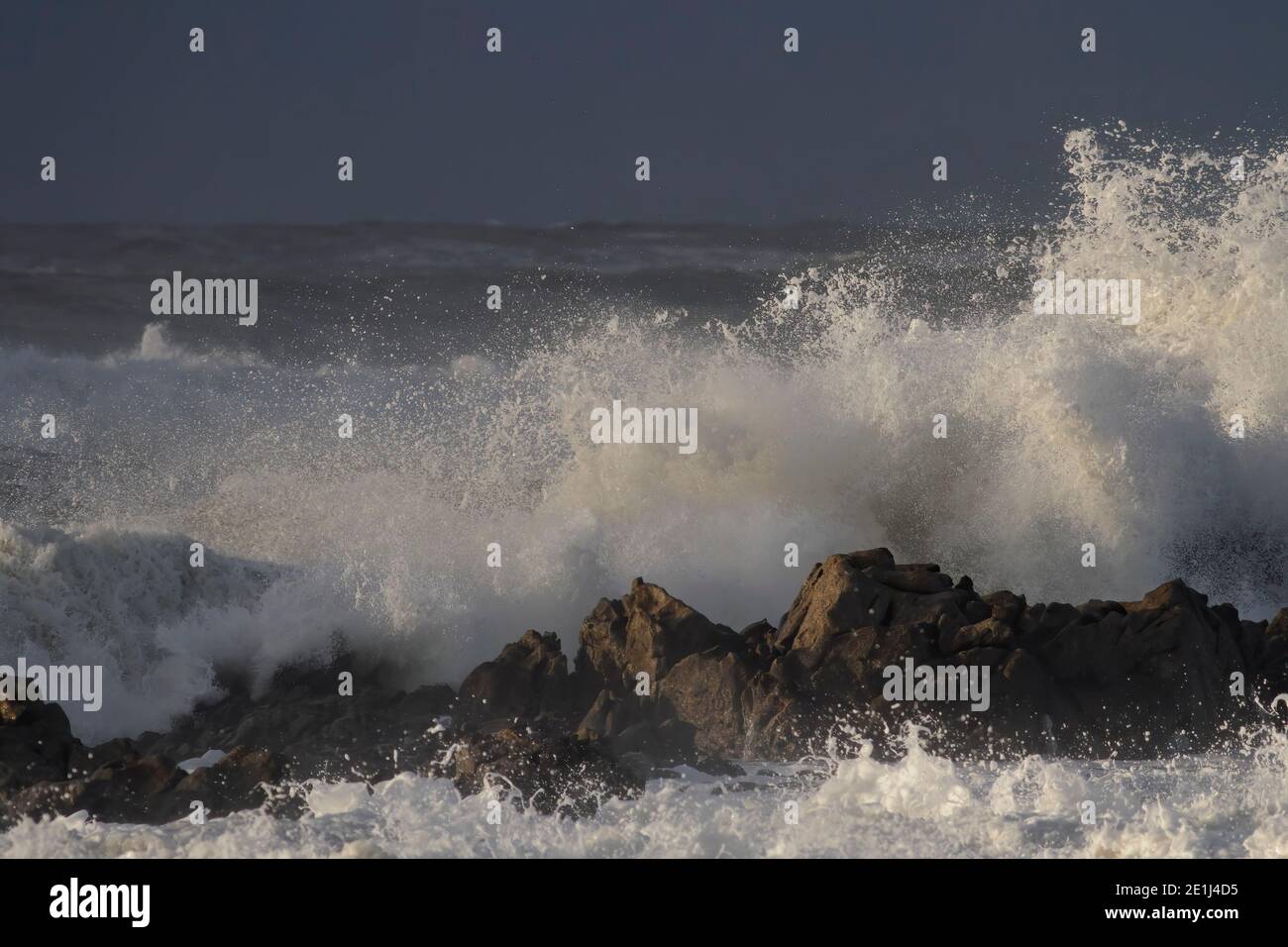 Powerful waves crash over rocks hi-res stock photography and images - Alamy