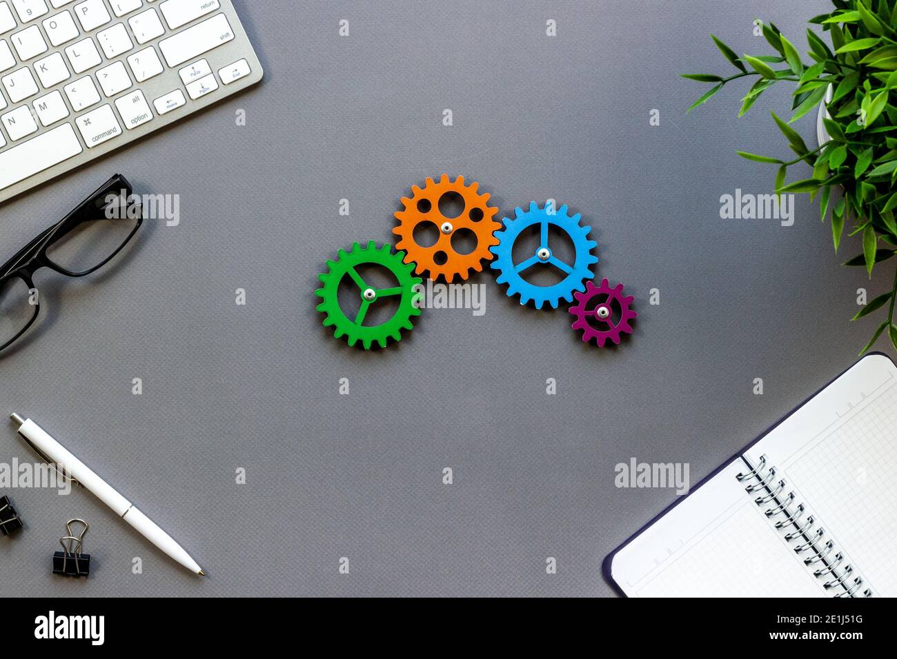Business process and teamwork concept - working gears on office table, top view Stock Photo - Alamy