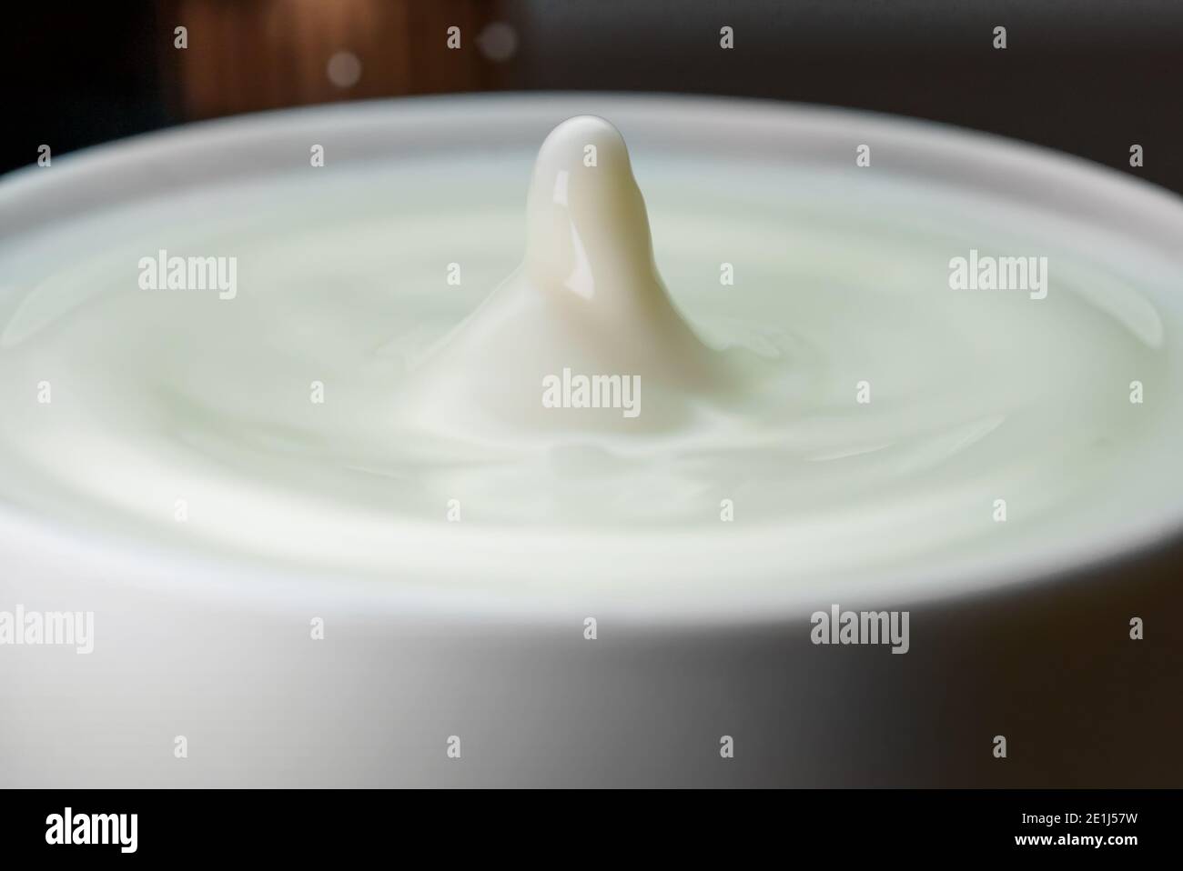 Milk drop falls filled cup hi-res stock photography and images - Alamy