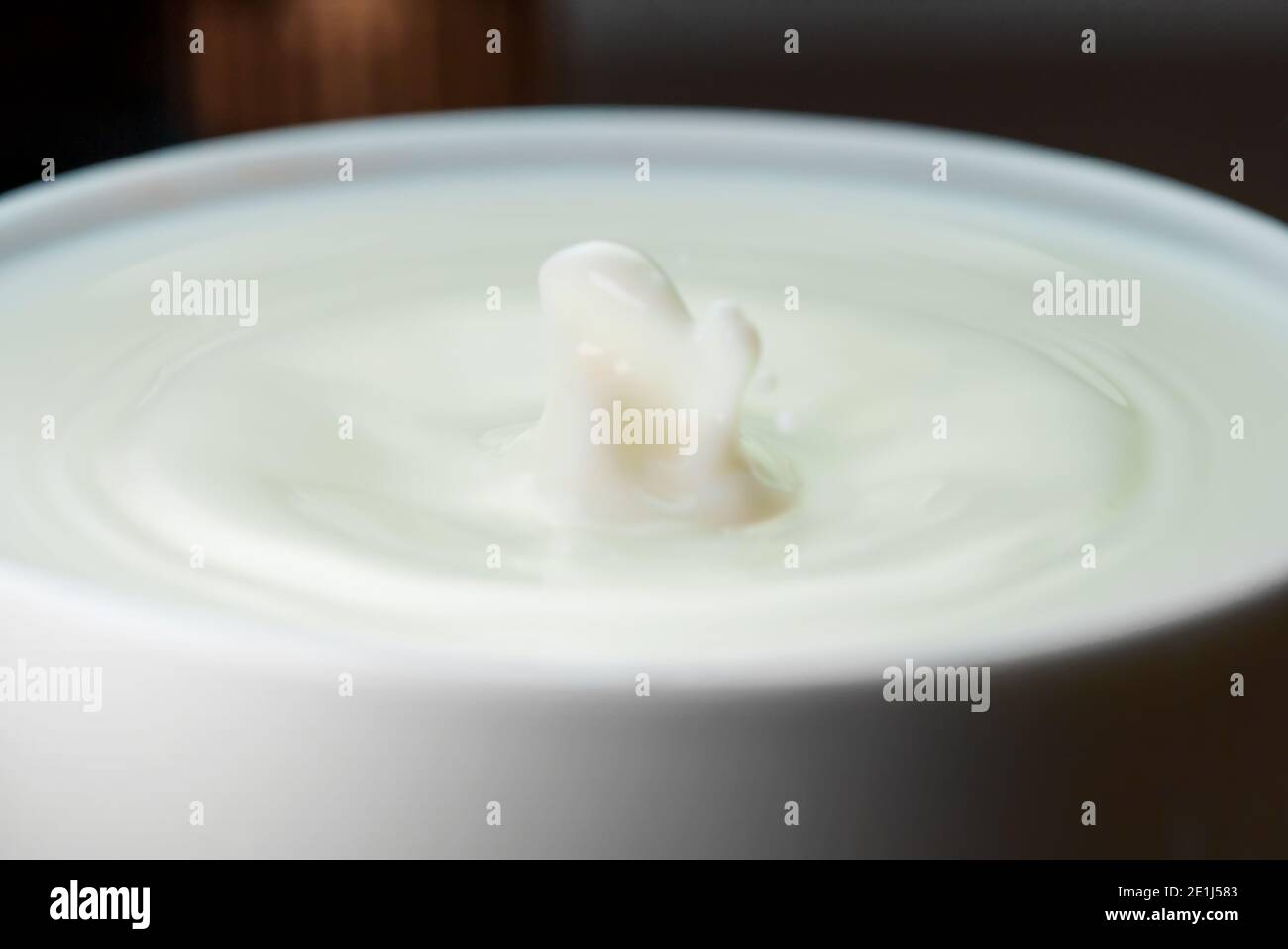 Milk drop falls filled cup hi-res stock photography and images - Alamy