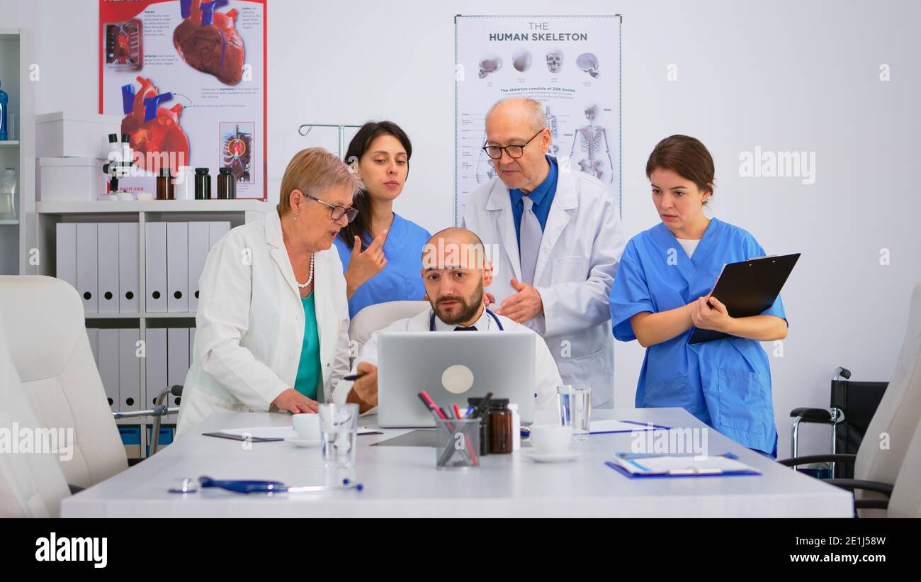 Group of doctors having health brainstorming conference in hospital ...