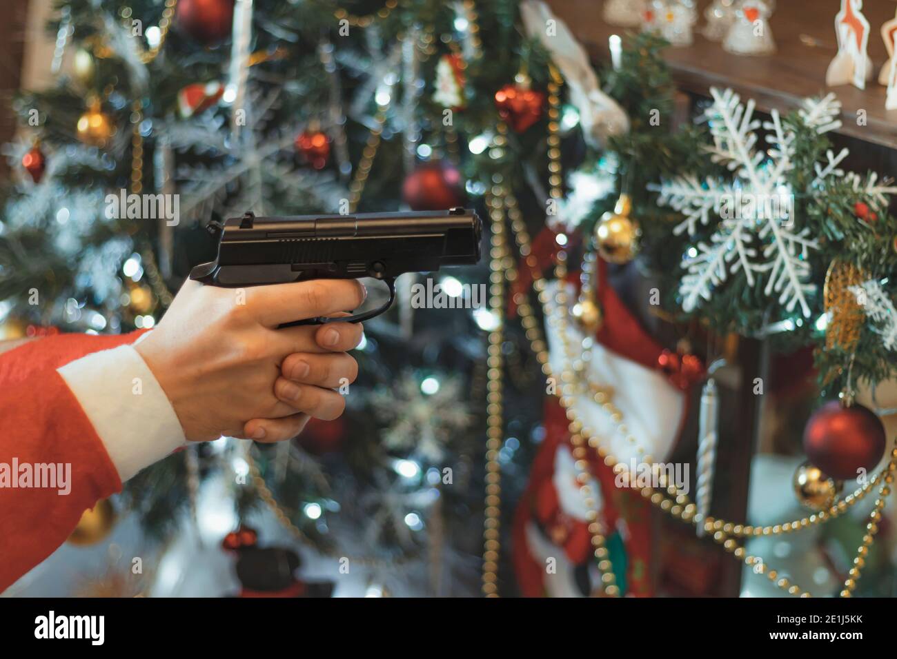 Santa with gun hi-res stock photography and images - Alamy