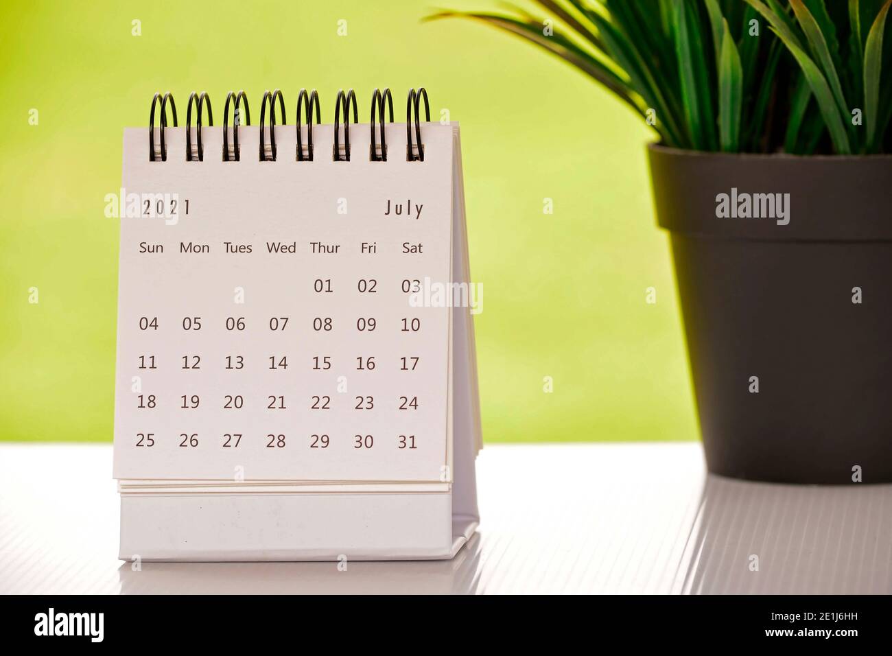 White July 2021 calendar with green backgrounds and potted plant. 2021 ...