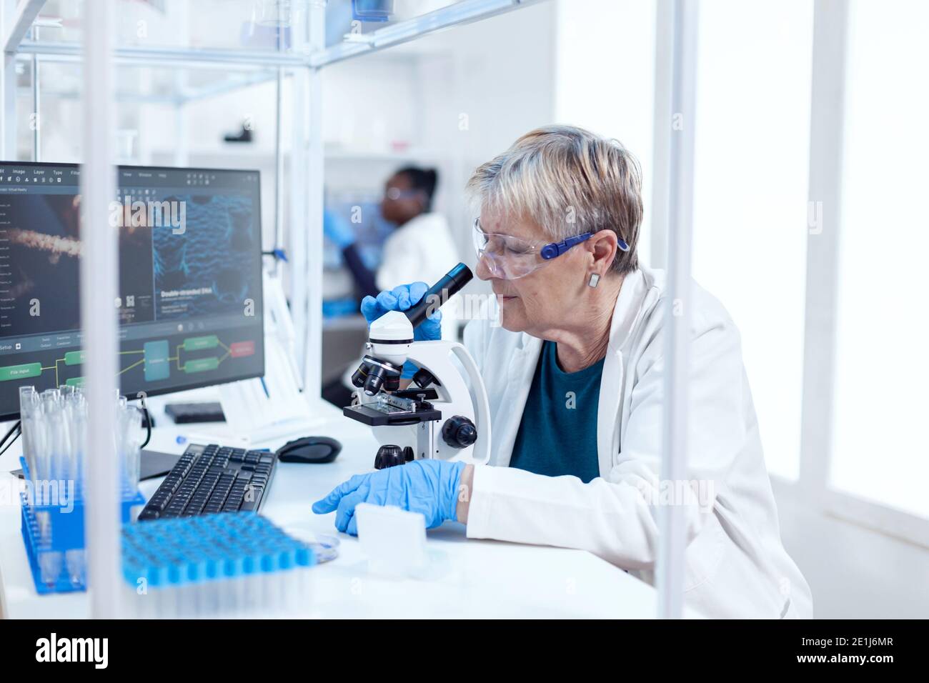 Senior scientist doing medical analysis and engineering using ...