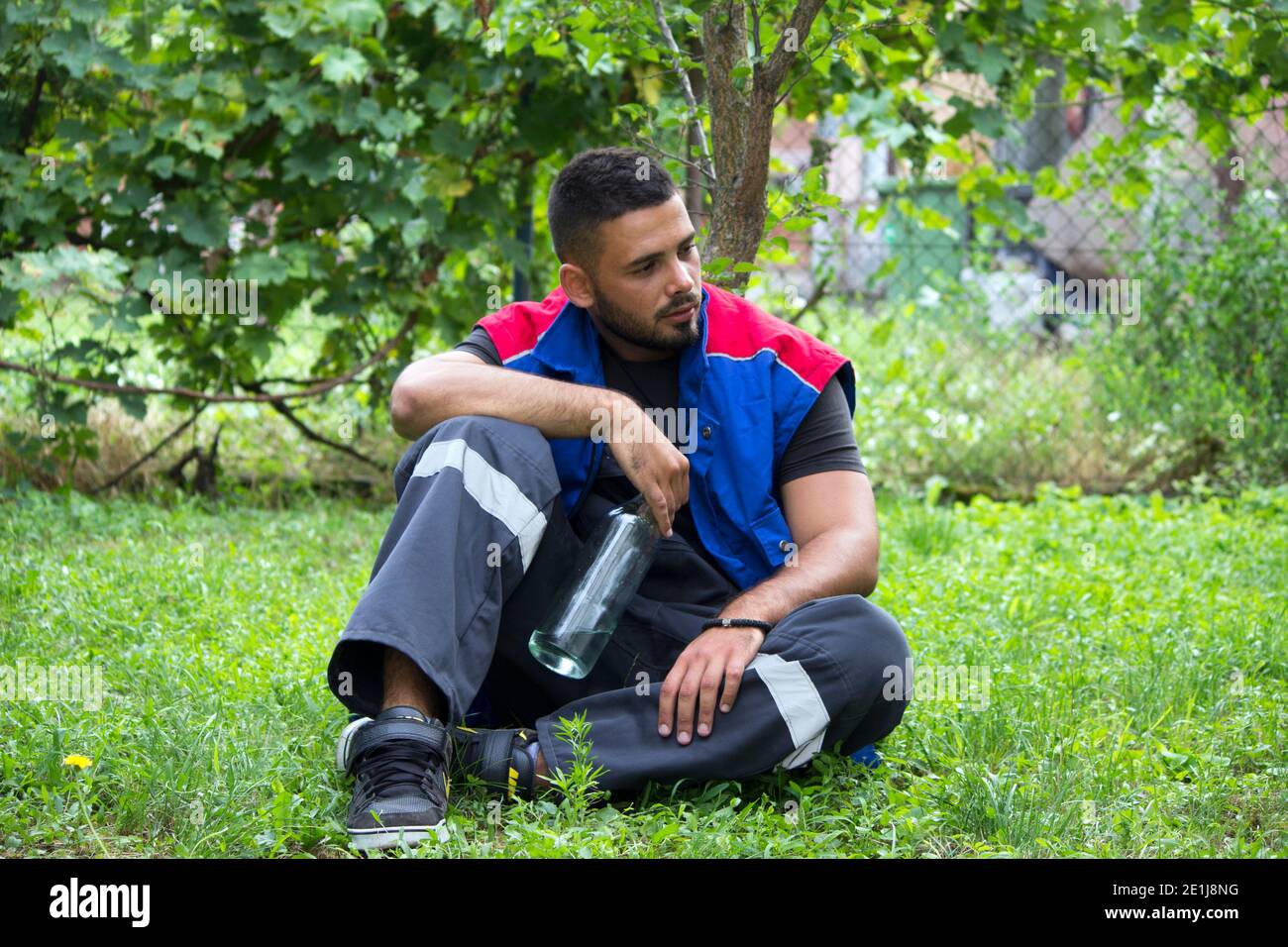 drunk young worker Stock Photo - Alamy