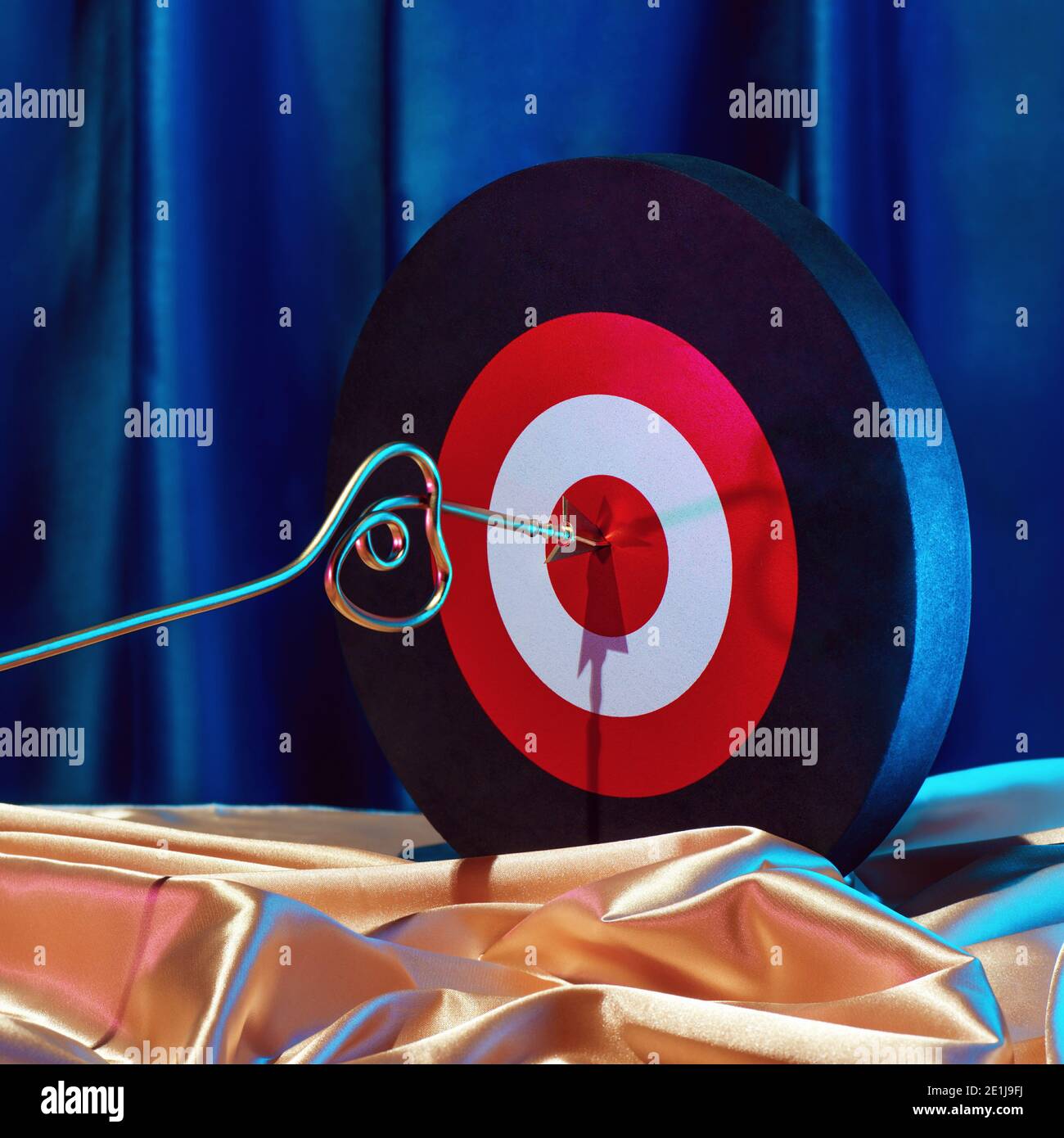 Small golden cupid marks his target with an arrow at the heart ...