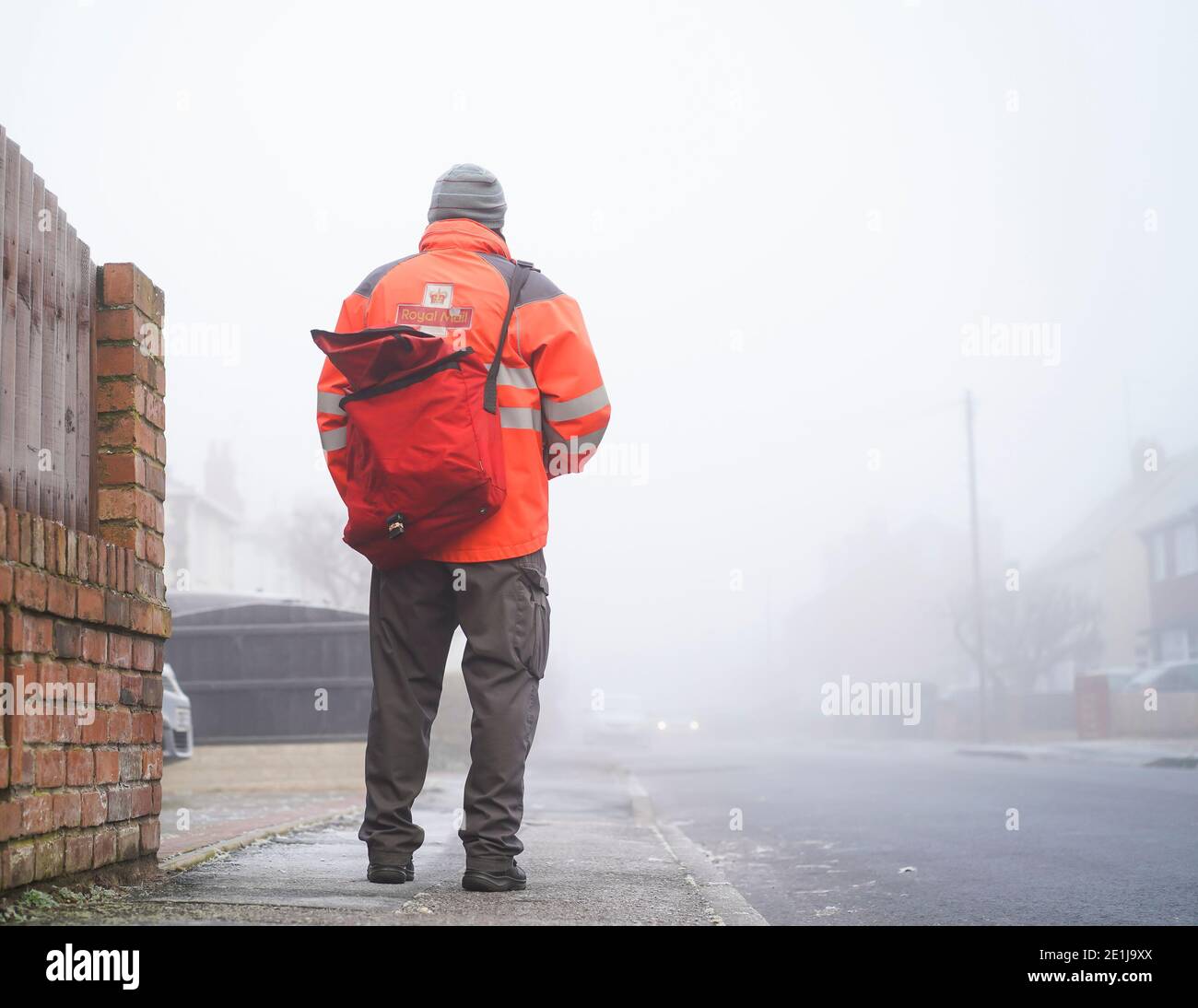Back view postman uk hi-res stock photography and images - Alamy