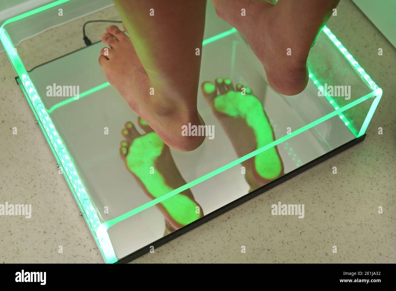 Foot step analysis on feet scanner - footprints visible in green light ...
