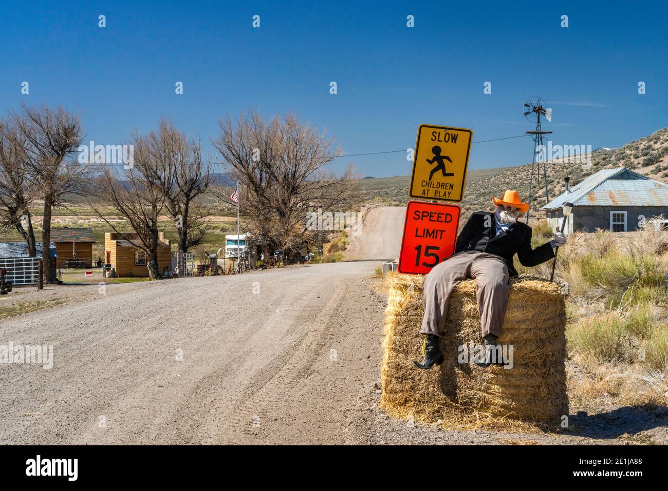 Man of hay figure at speed limit warning sign, near Reese River Cabins ...