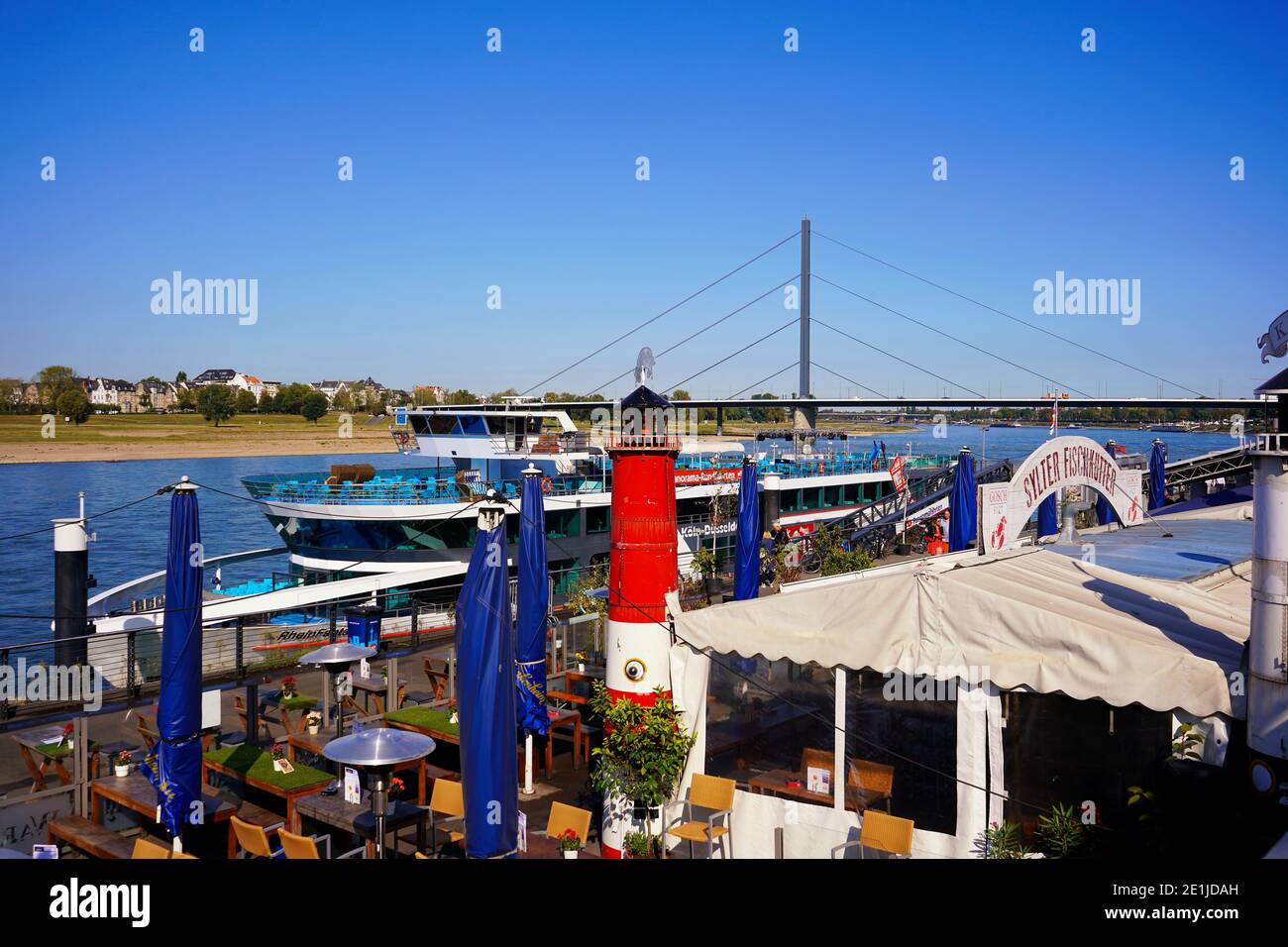 The popular tourist destination Rhine river promenade on a beautiful ...