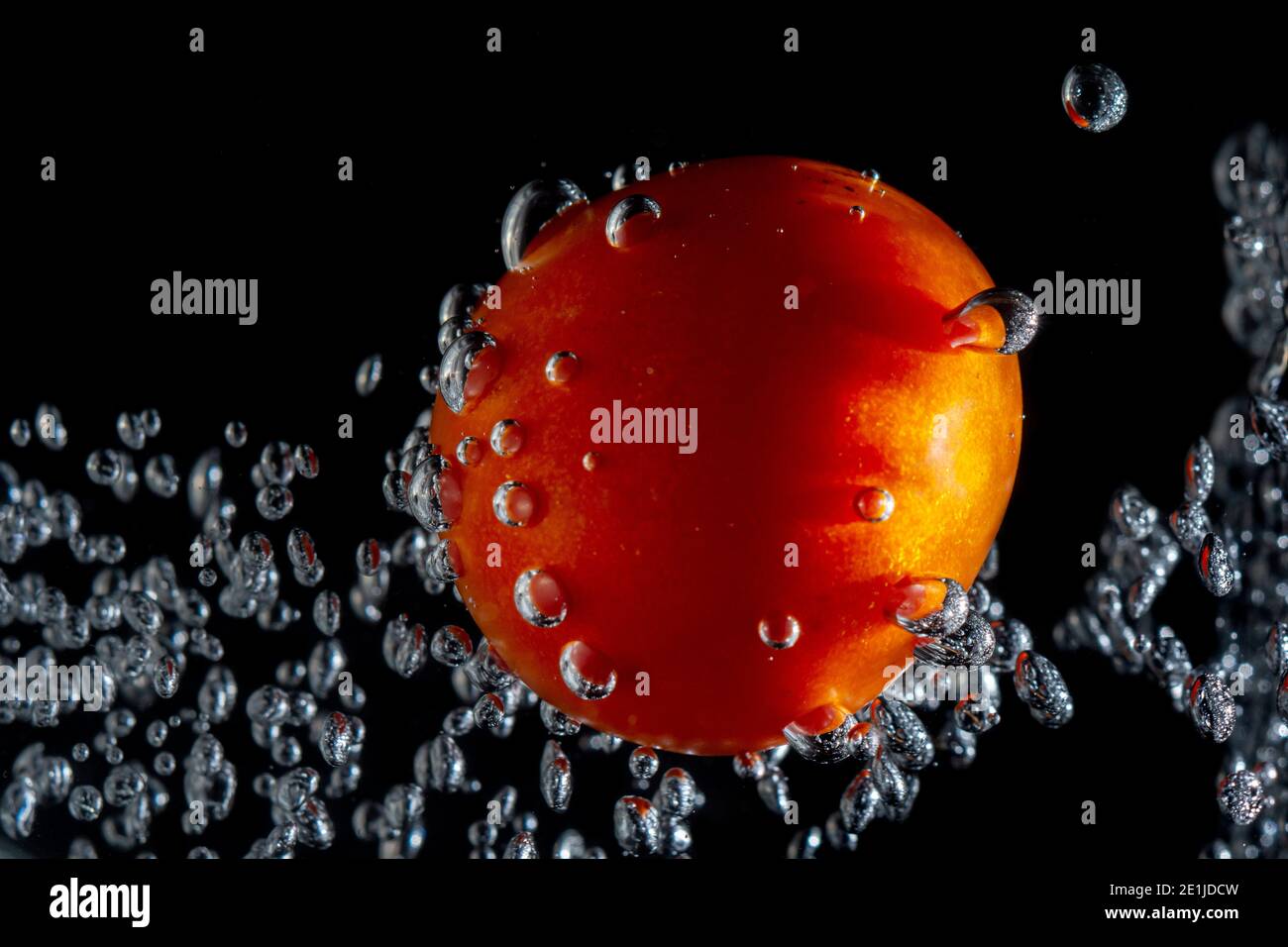fresh red tomato with water bubbles. the concept of freshness of fruit ...