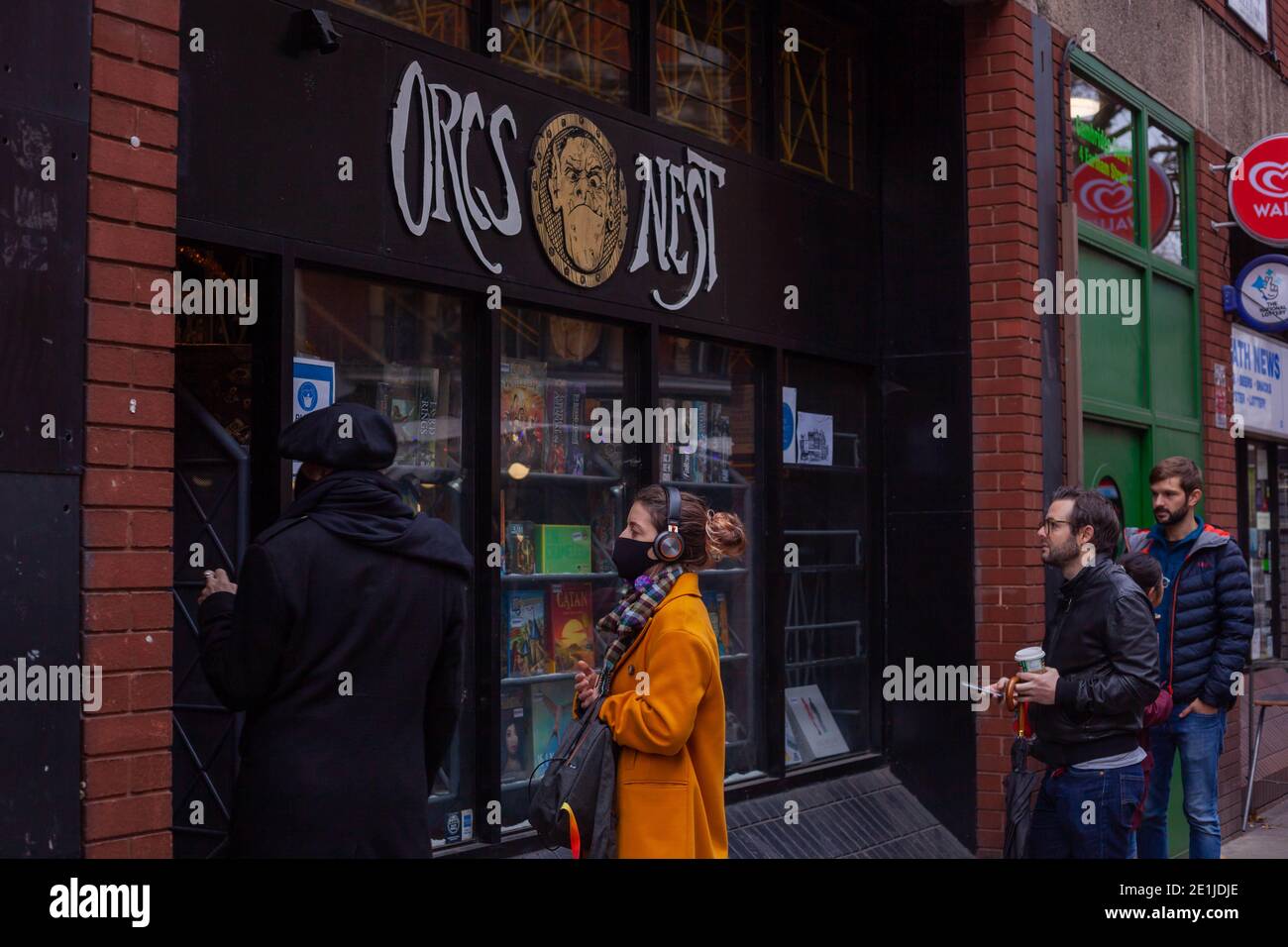 RPG Gaming Concept / Tech Lifestyle - View of several people queuing ...