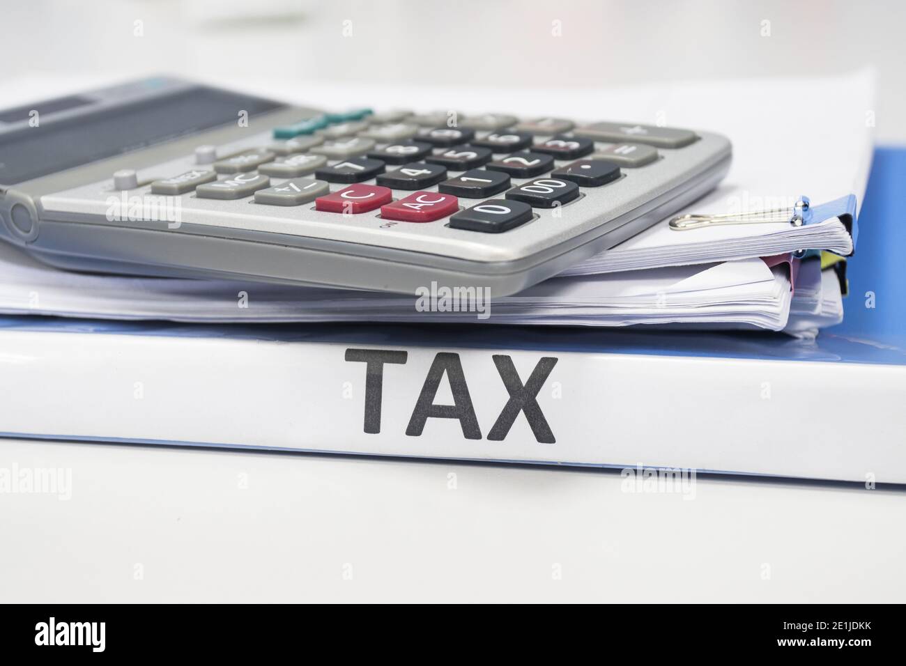 Folder Tax documents and paper files with calculator concept Annual tax ...