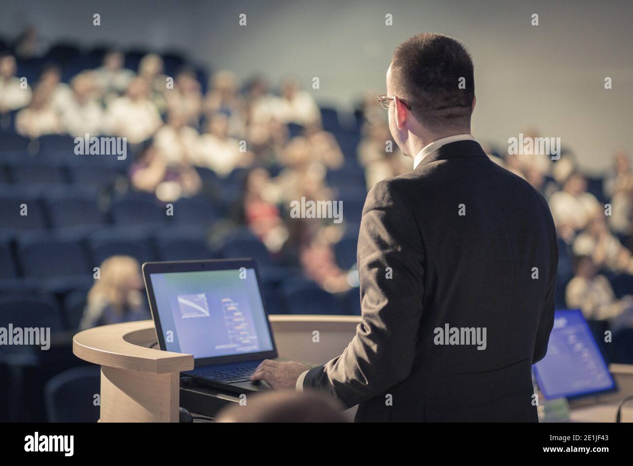 Public speaker giving talk at business event Stock Photo - Alamy