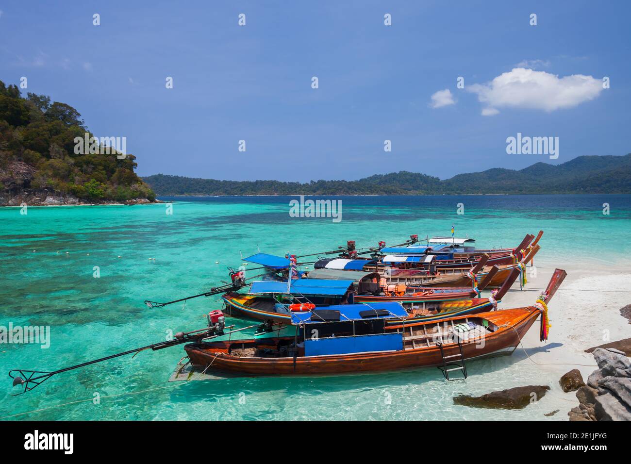 boats are floating on beach againts sky Stock Photo - Alamy