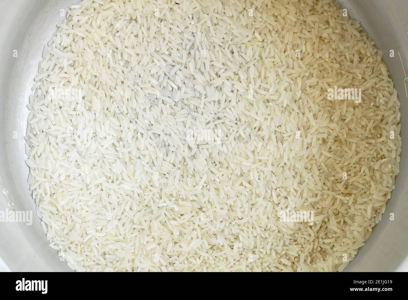 rice paddy in cooking pot prepare for steam Stock Photo - Alamy