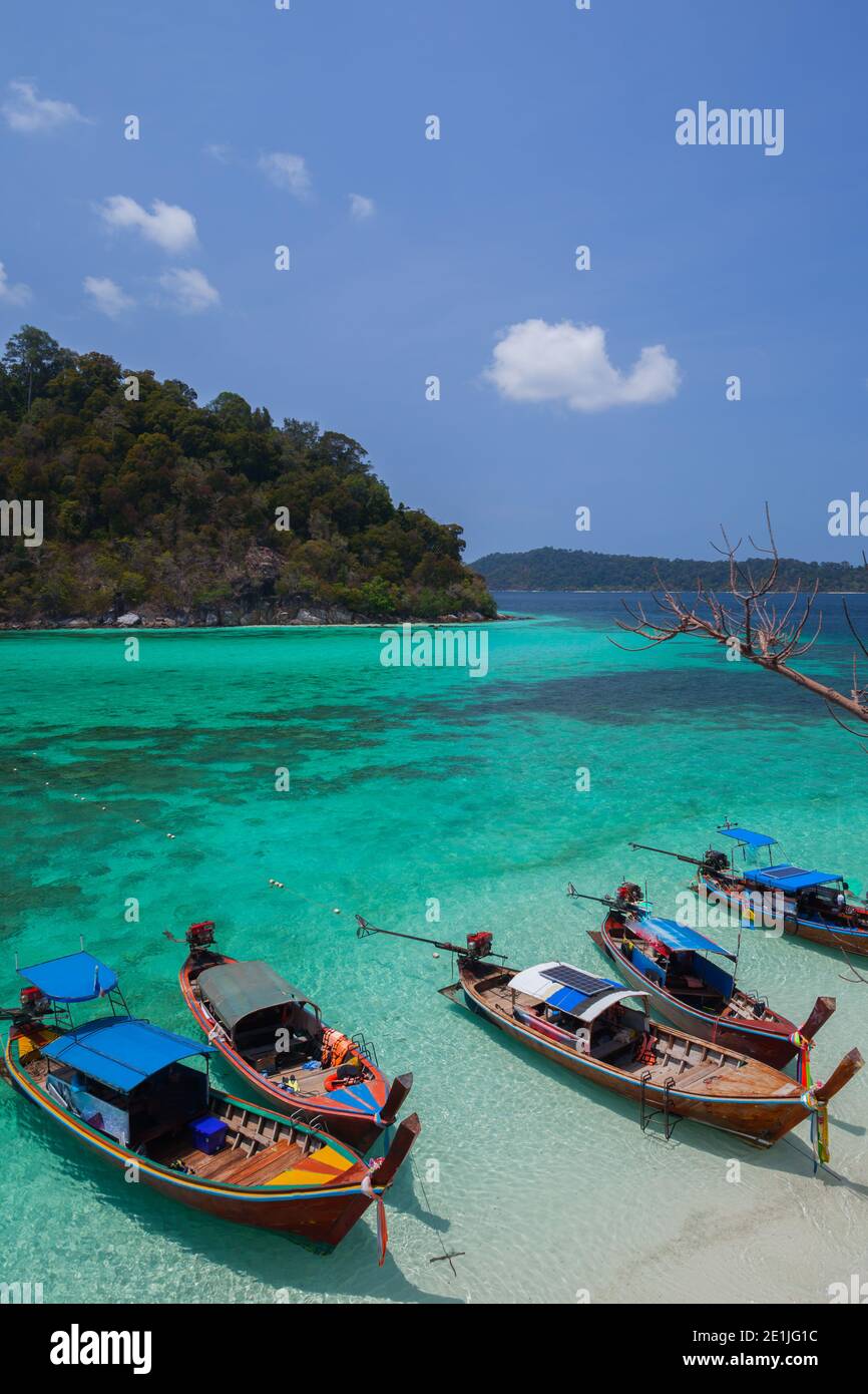 boats are floating on beach againts sky Stock Photo - Alamy