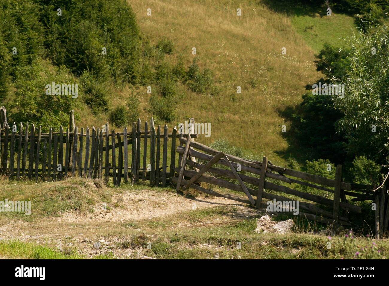 Simple wooden fence and gate in Romania's countryside Stock Photo - Alamy