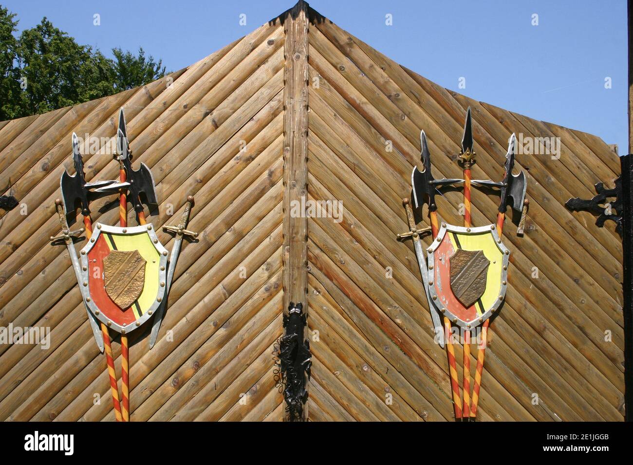 Replica of medieval weapons and shields on the entrance gates to a ...