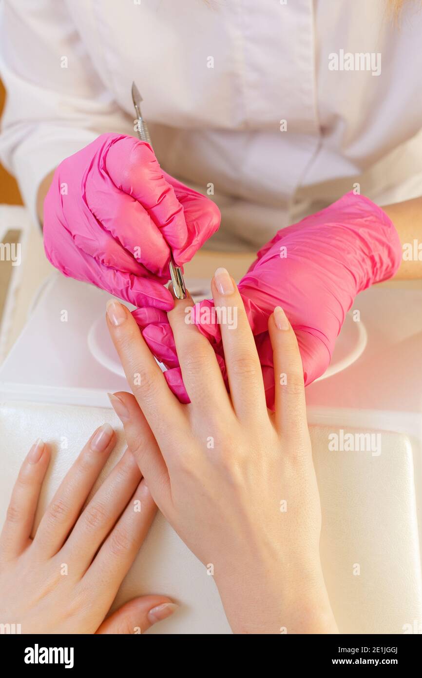 Manicure master in mask doing hi-res stock photography and images - Alamy