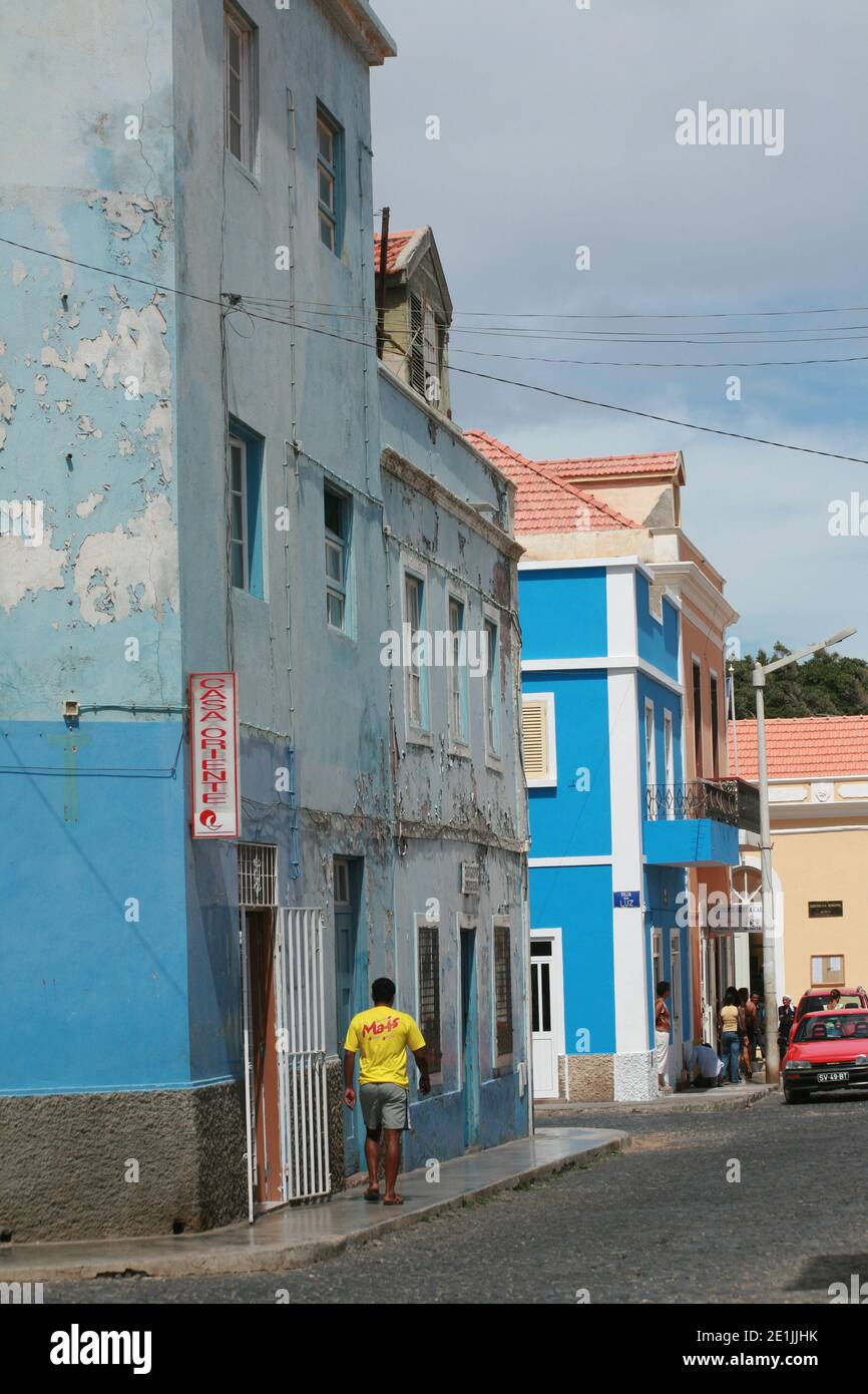 A man walking along the sidewalk. Street view of Mindelo city, Sao ...