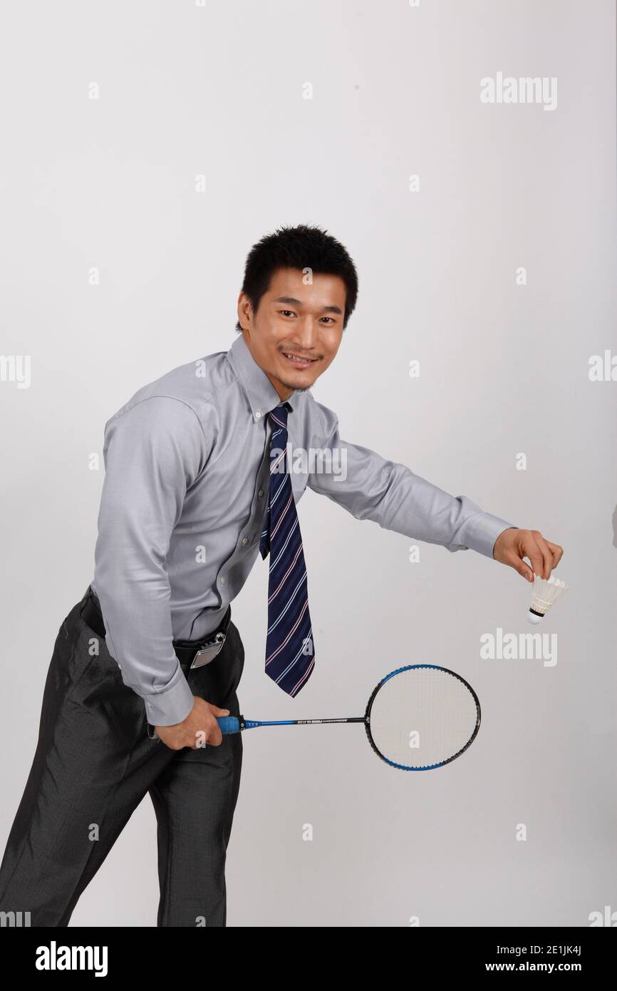 A business exercising with man playing badminton high quality photo ...