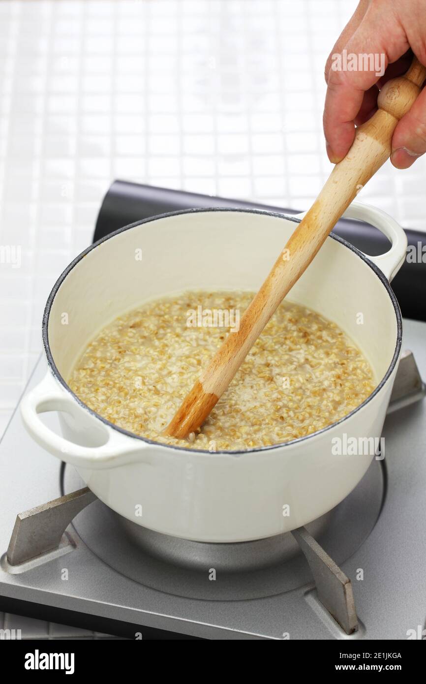 making traditional Scottish porridge by wooden spurtle Stock Photo - Alamy