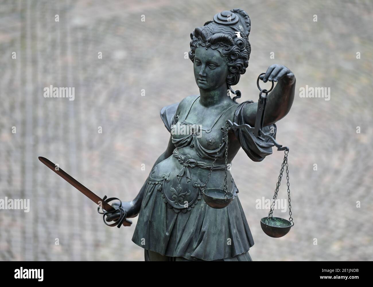 07 January 2021, Hessen, Frankfurt/Main: The statue of Justitia stands ...