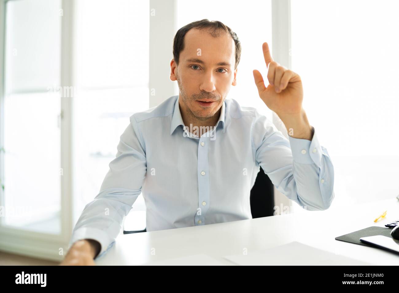Man raising hand hi-res stock photography and images - Alamy