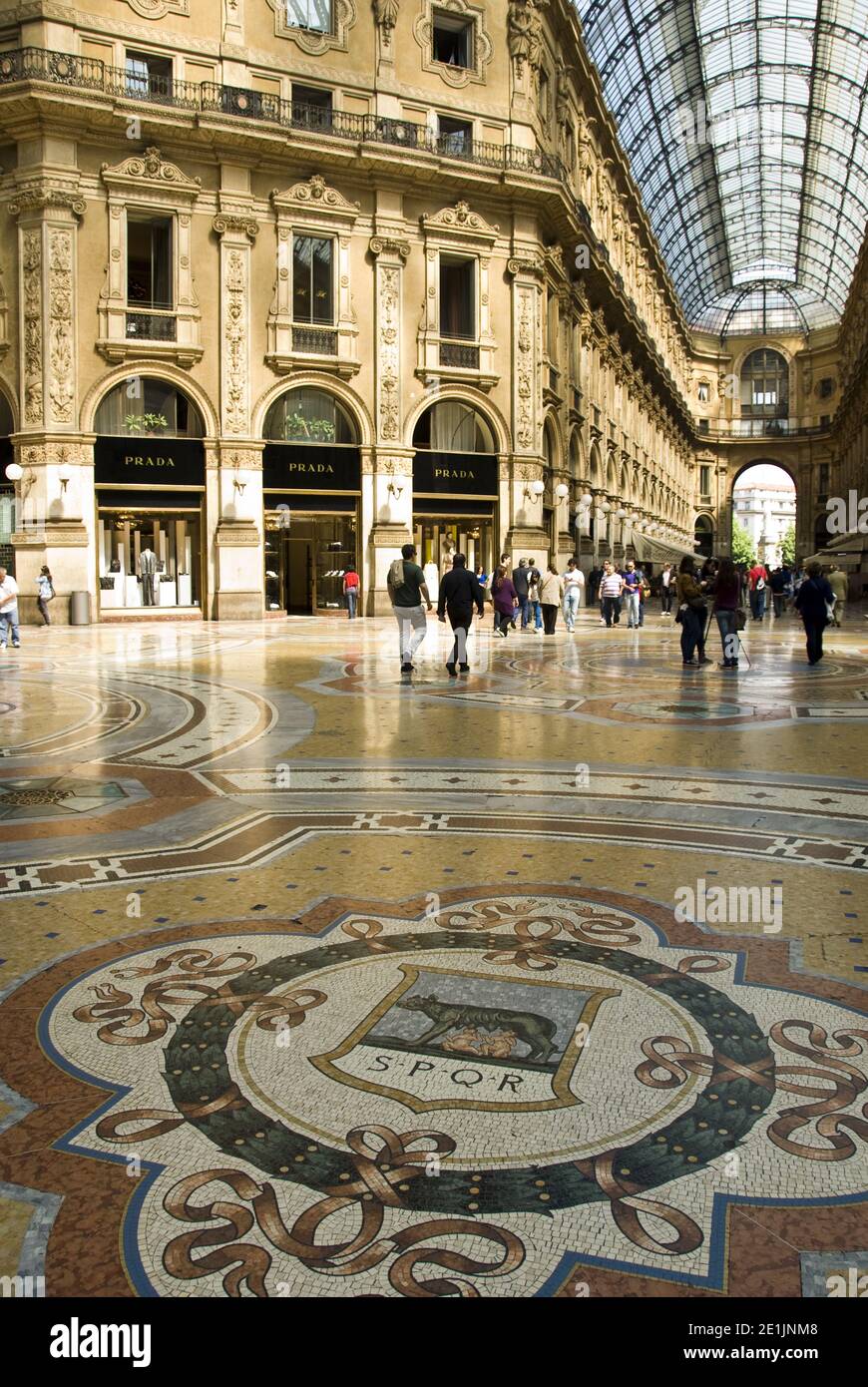 Shoppers walk over a mosaic tile floor in the Galleria Vittorio ...