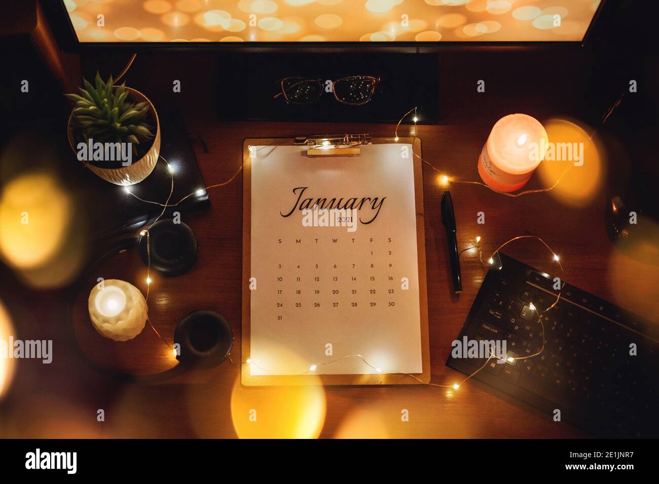 Flat lay with paper calendar january month 2021, keyboard and monitor ...