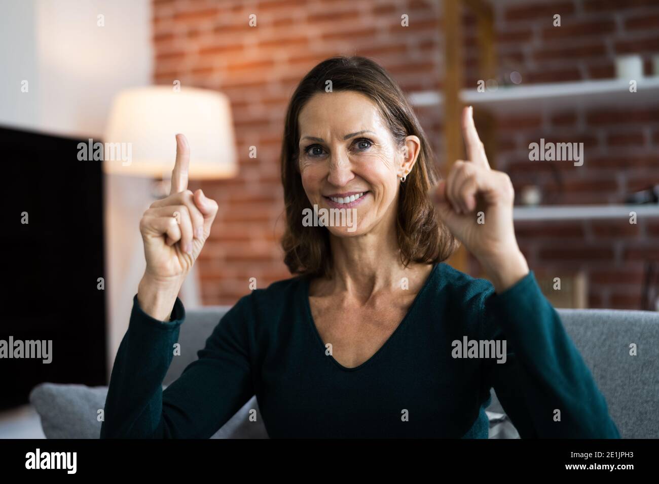 Adult Learning Sign Language For Deaf Disabled Stock Photo - Alamy