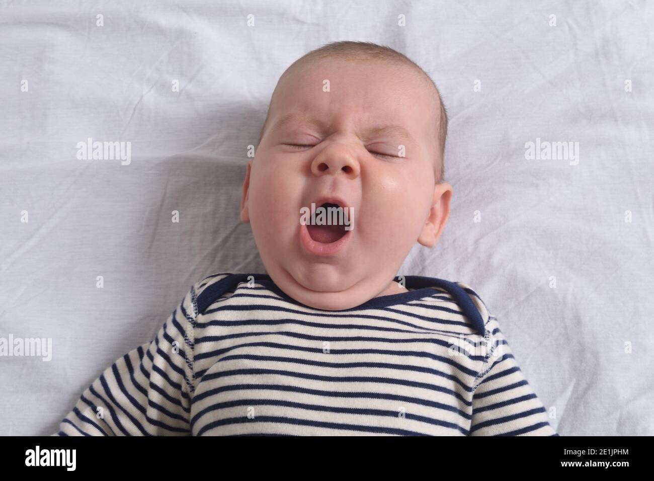 relaxed baby yawning Stock Photo - Alamy