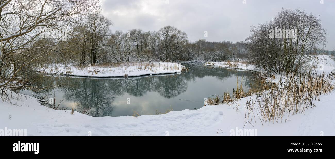 Panoramic landscape with snowy trees, beautiful frozen river with ...