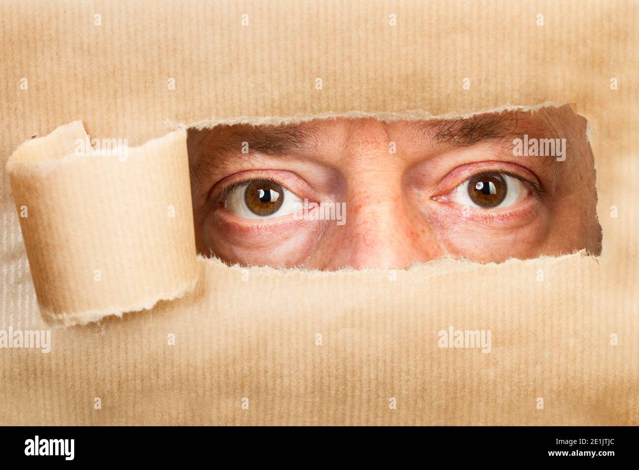 Tear paper eyes hi-res stock photography and images - Alamy
