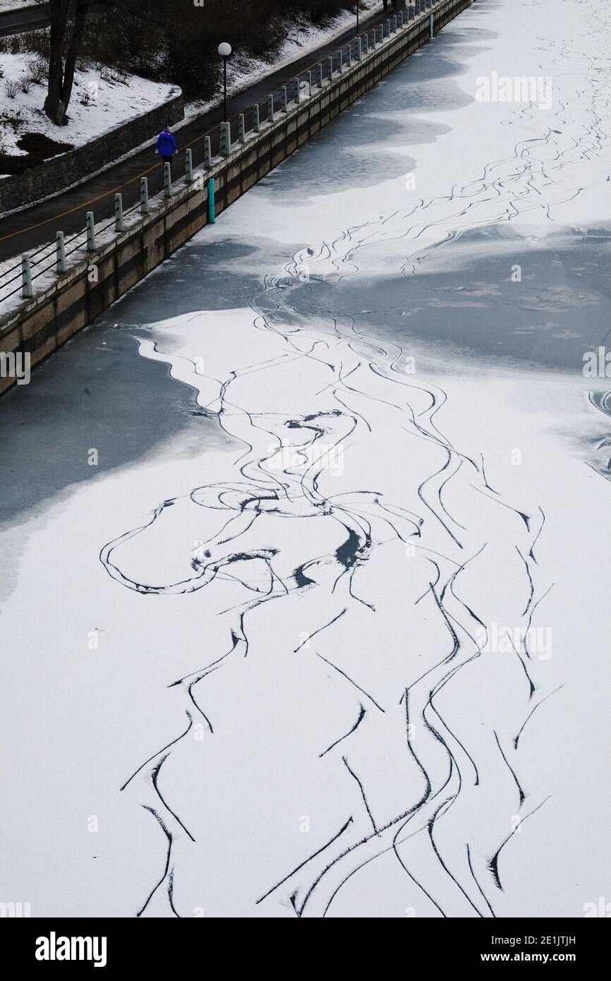 Ice skating marks on the fresh snow on the Rideau Canal make ...