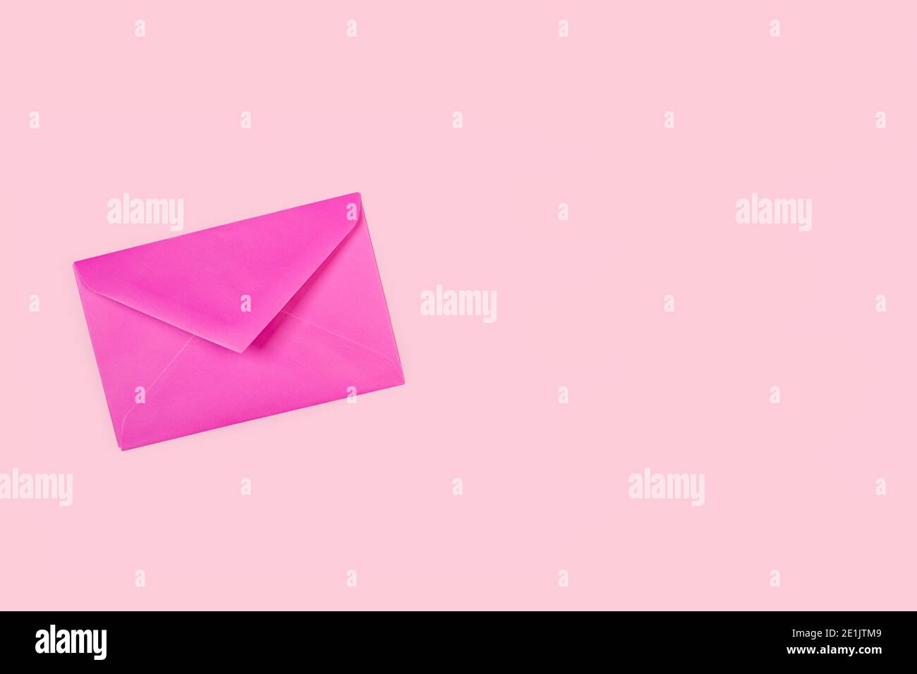 A purple envelope on a pink background with copy space Stock Photo - Alamy