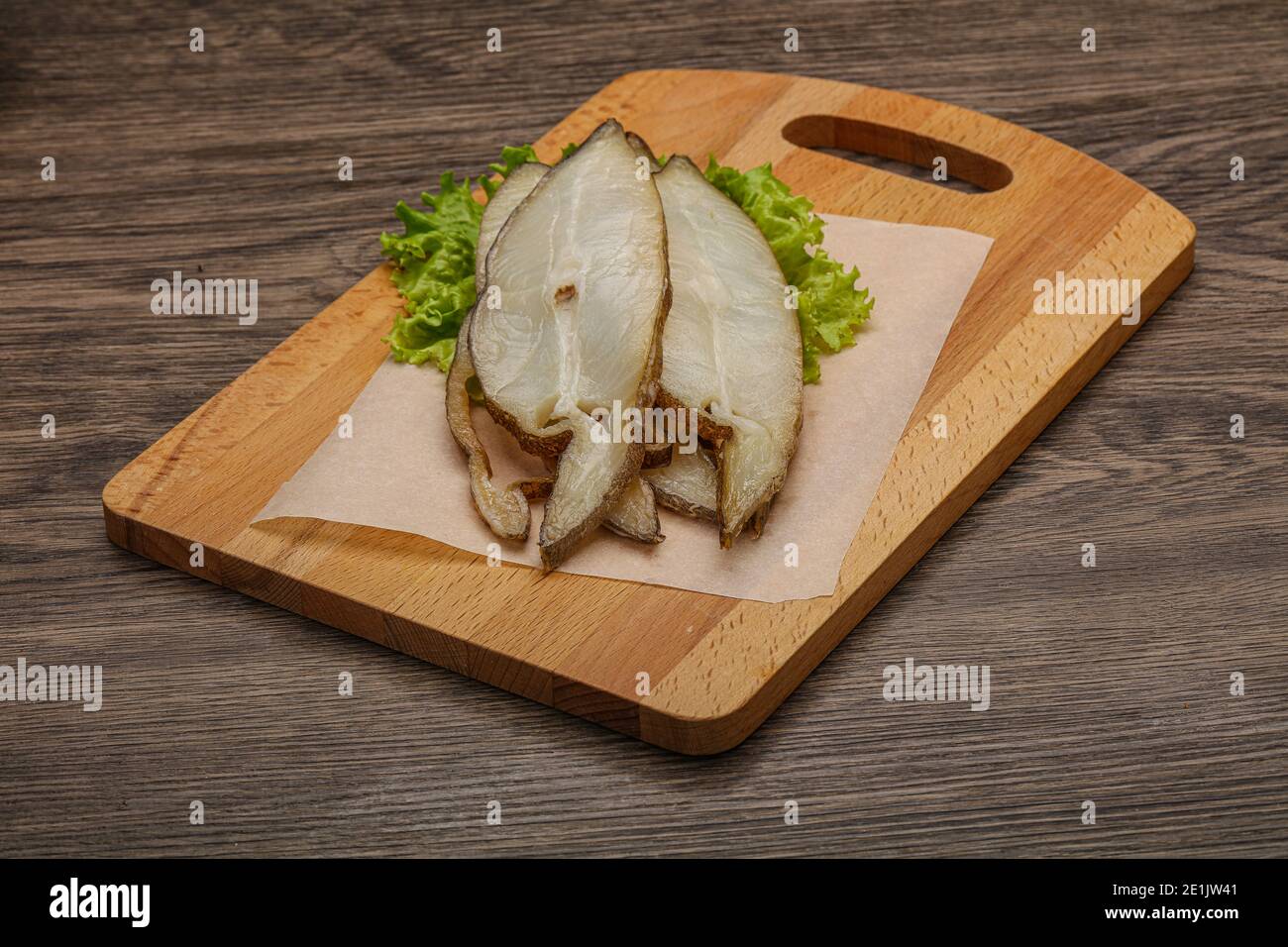 Delicous smoked halibut fish slices snack Stock Photo - Alamy