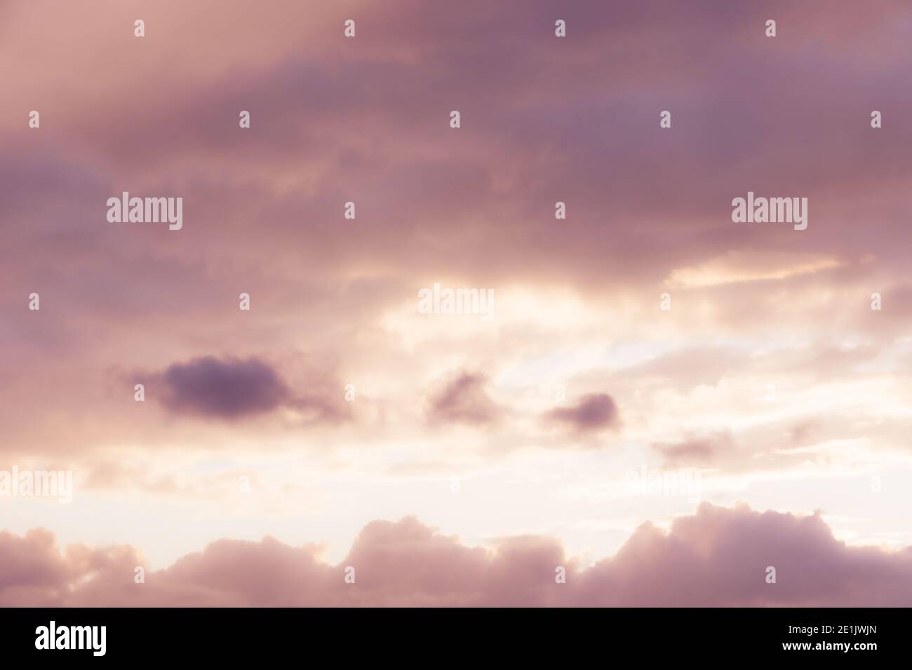 Soft pink clouds in sunset sky Stock Photo - Alamy