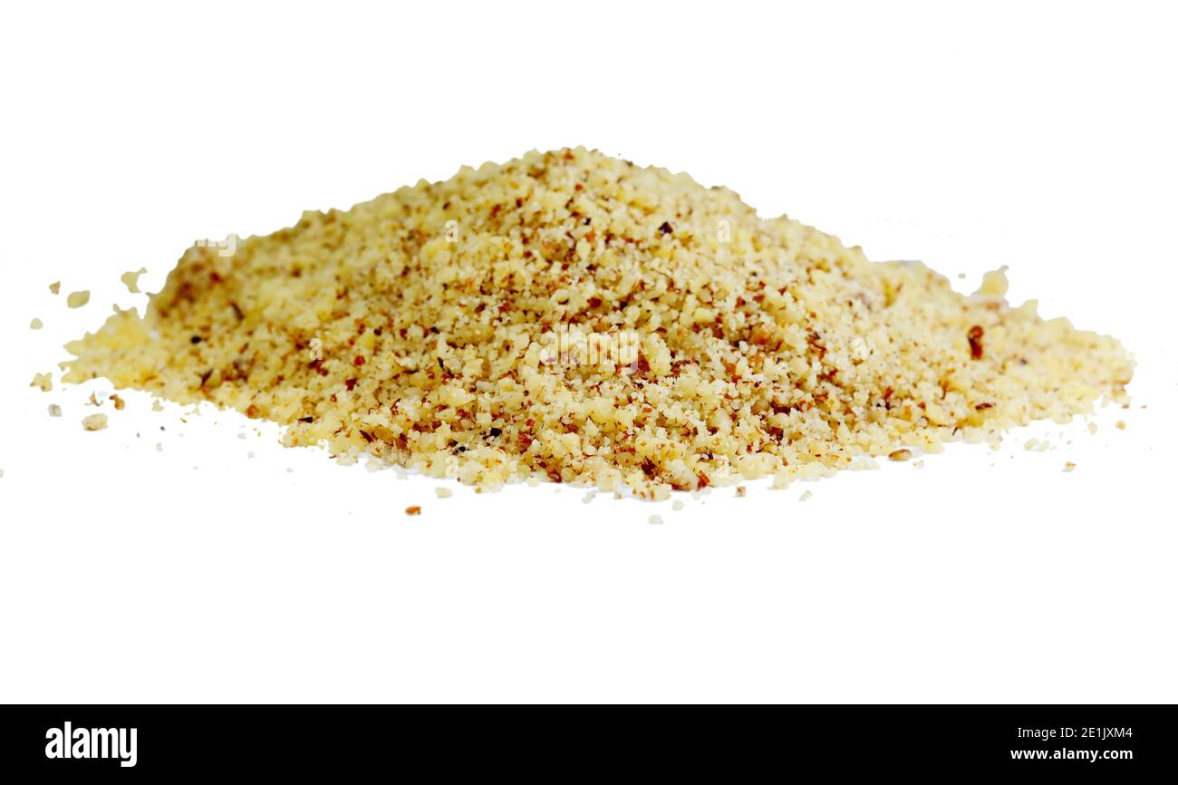 Ground walnuts powder on white. Chopped walnuts pile isolated on white ...