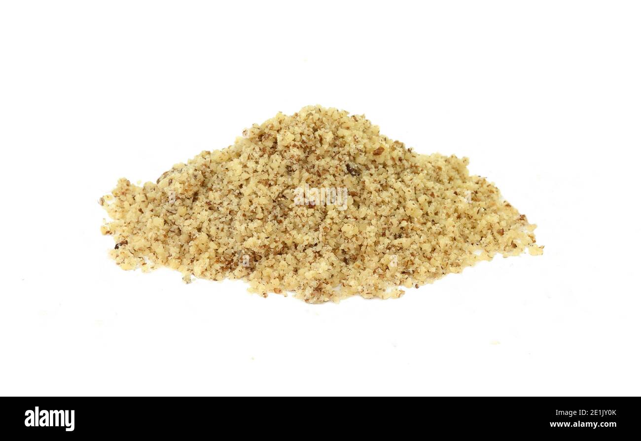Ground walnuts powder on white. Chopped walnuts pile isolated on white ...