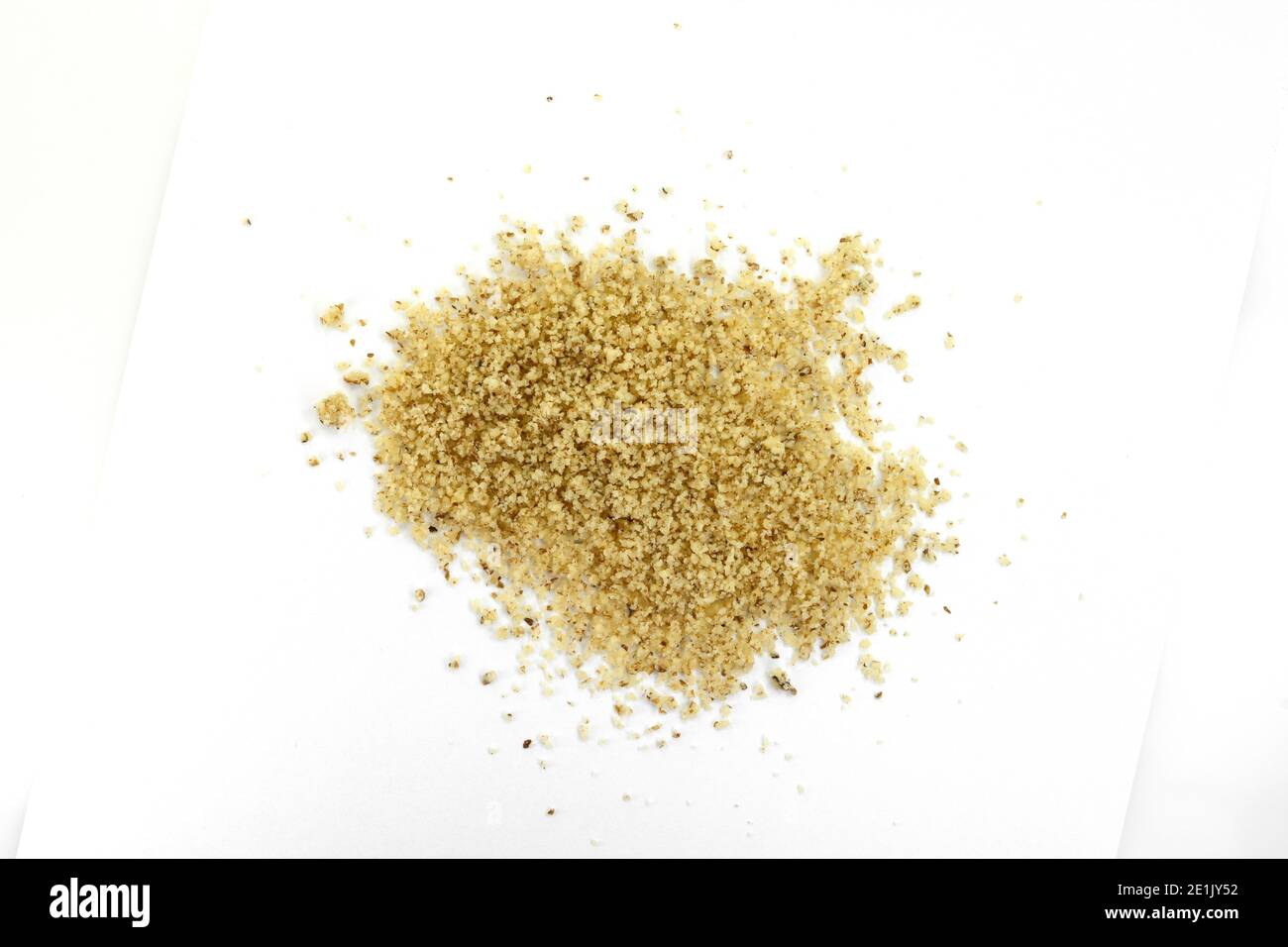 Ground walnuts powder on white. Chopped walnuts pile isolated on white ...