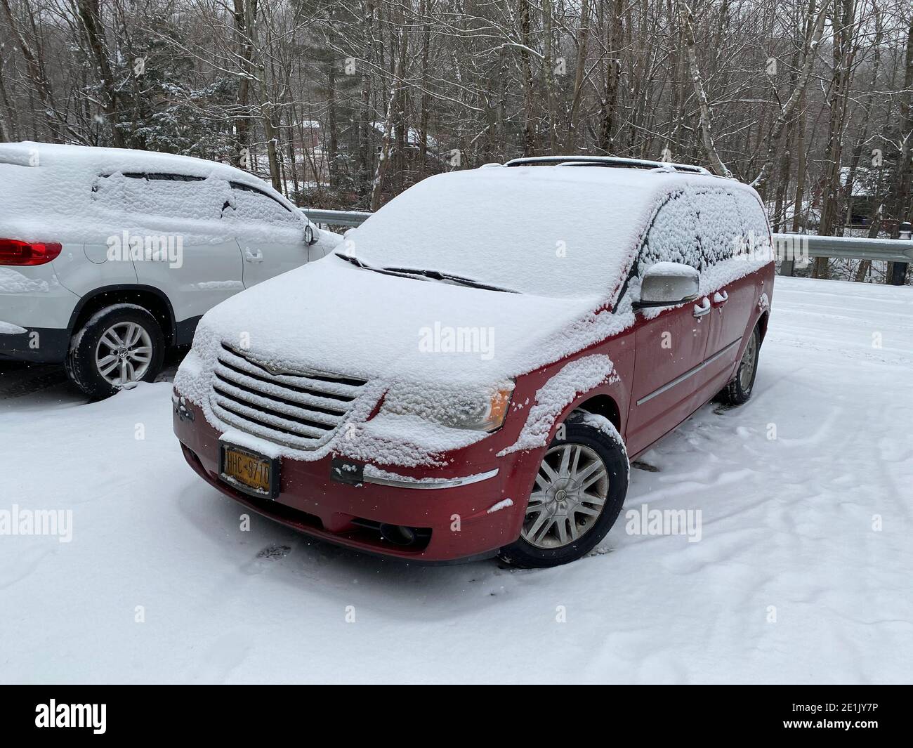 Fresh snow and snowflakes on the top of red car windows after early ...