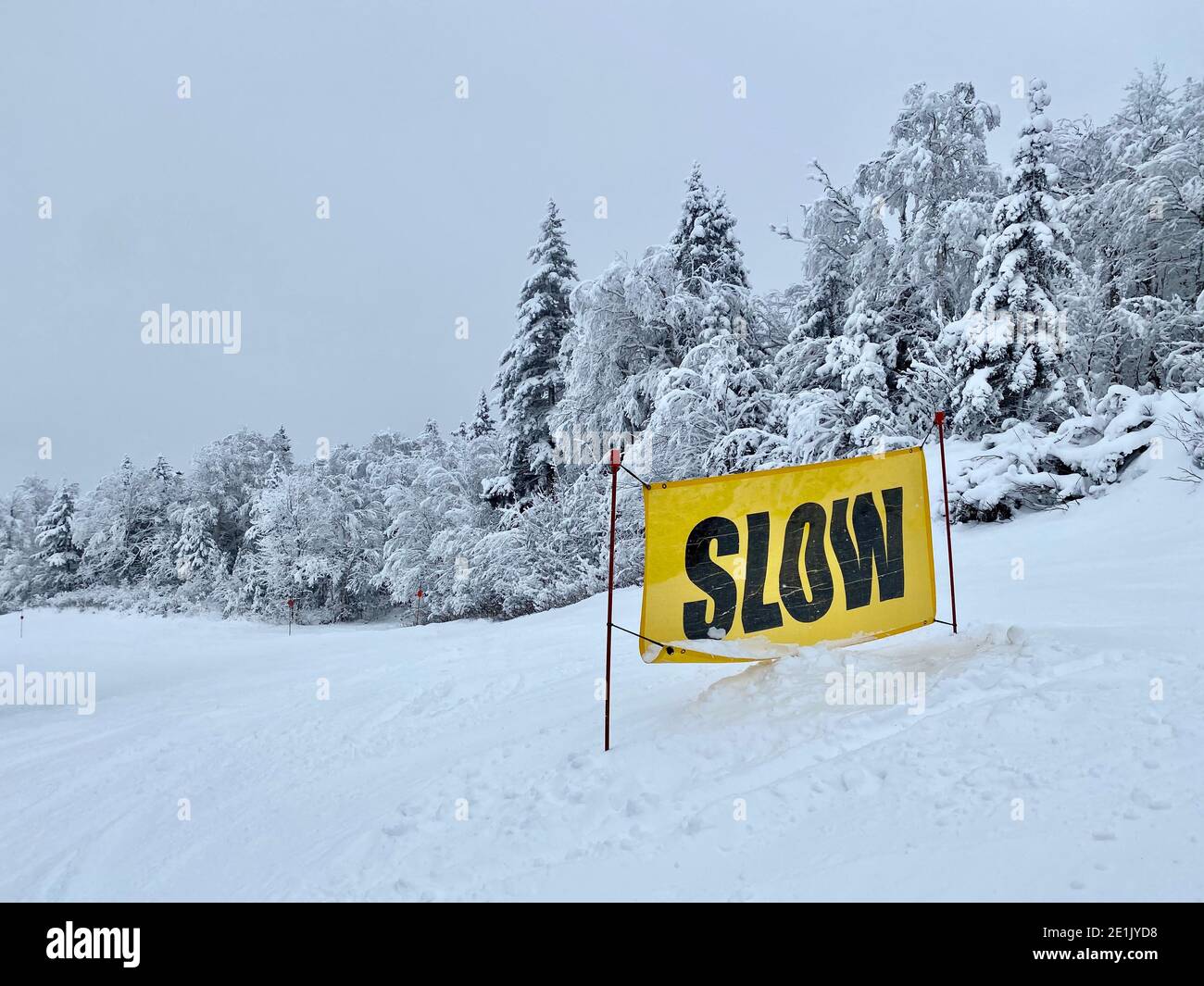 Slow down ski sign hi-res stock photography and images - Alamy