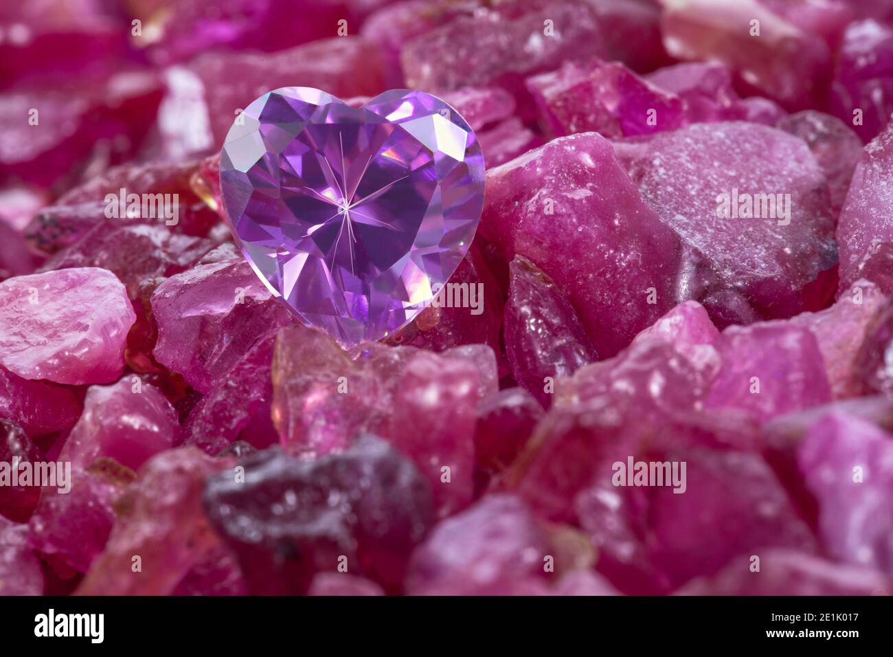 amethyst diamond heart shaped on raw Ruby Rough Gemstone Stock Photo ...