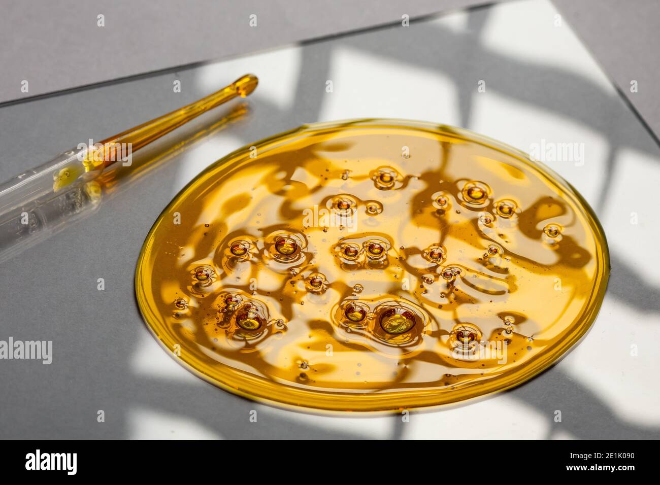 Yellow viscous liquid lecithin with bubbles on glass Stock Photo - Alamy