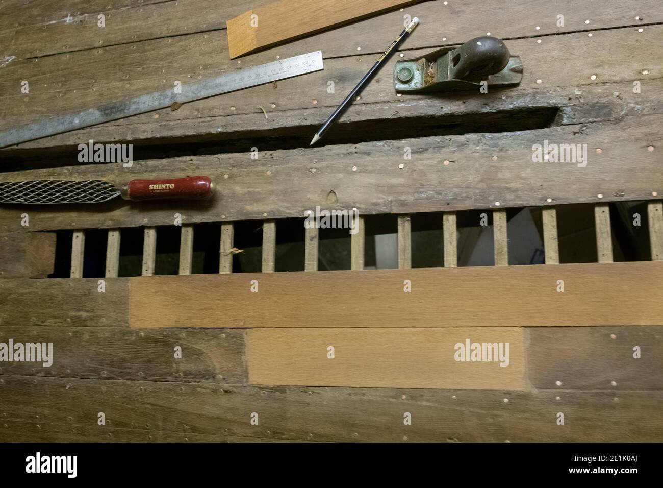 Restoring an old sailing dinghy with traditional tools Stock Photo - Alamy