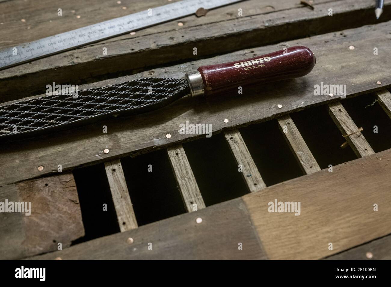 Restoring an old sailing dinghy with traditional tools Stock Photo - Alamy