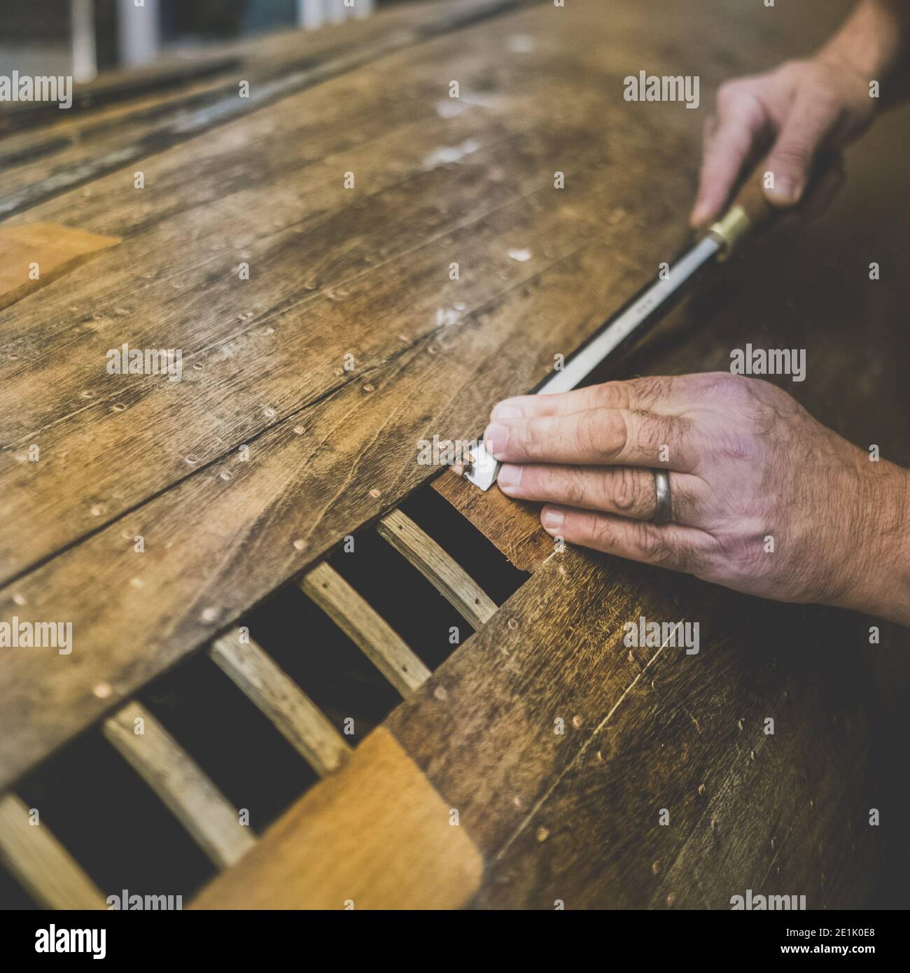 Restoring an old sailing dinghy with traditional tools Stock Photo - Alamy